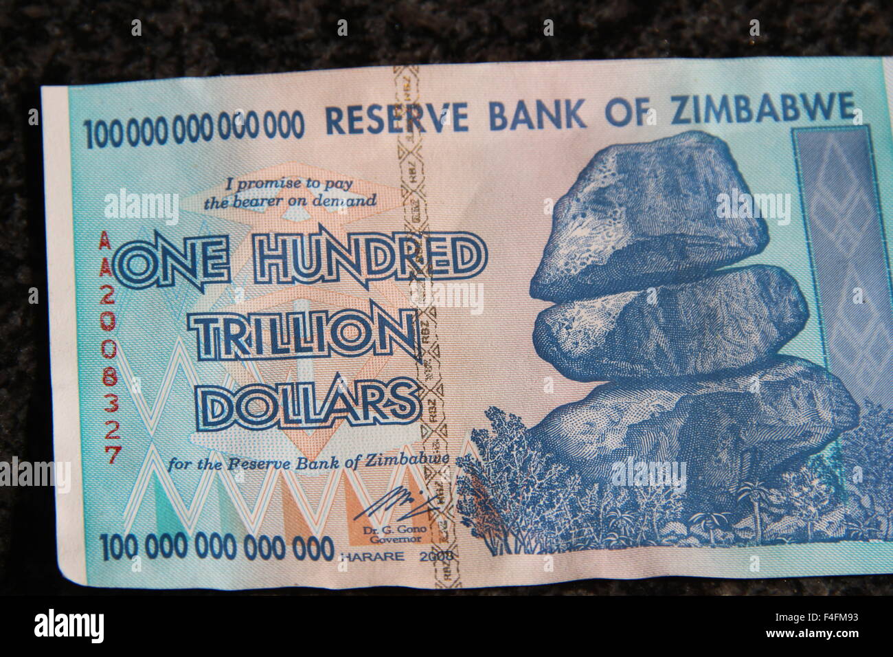 A banknote from Zimbabwe worth one hundred trillion Zimbabwean dollars ...
