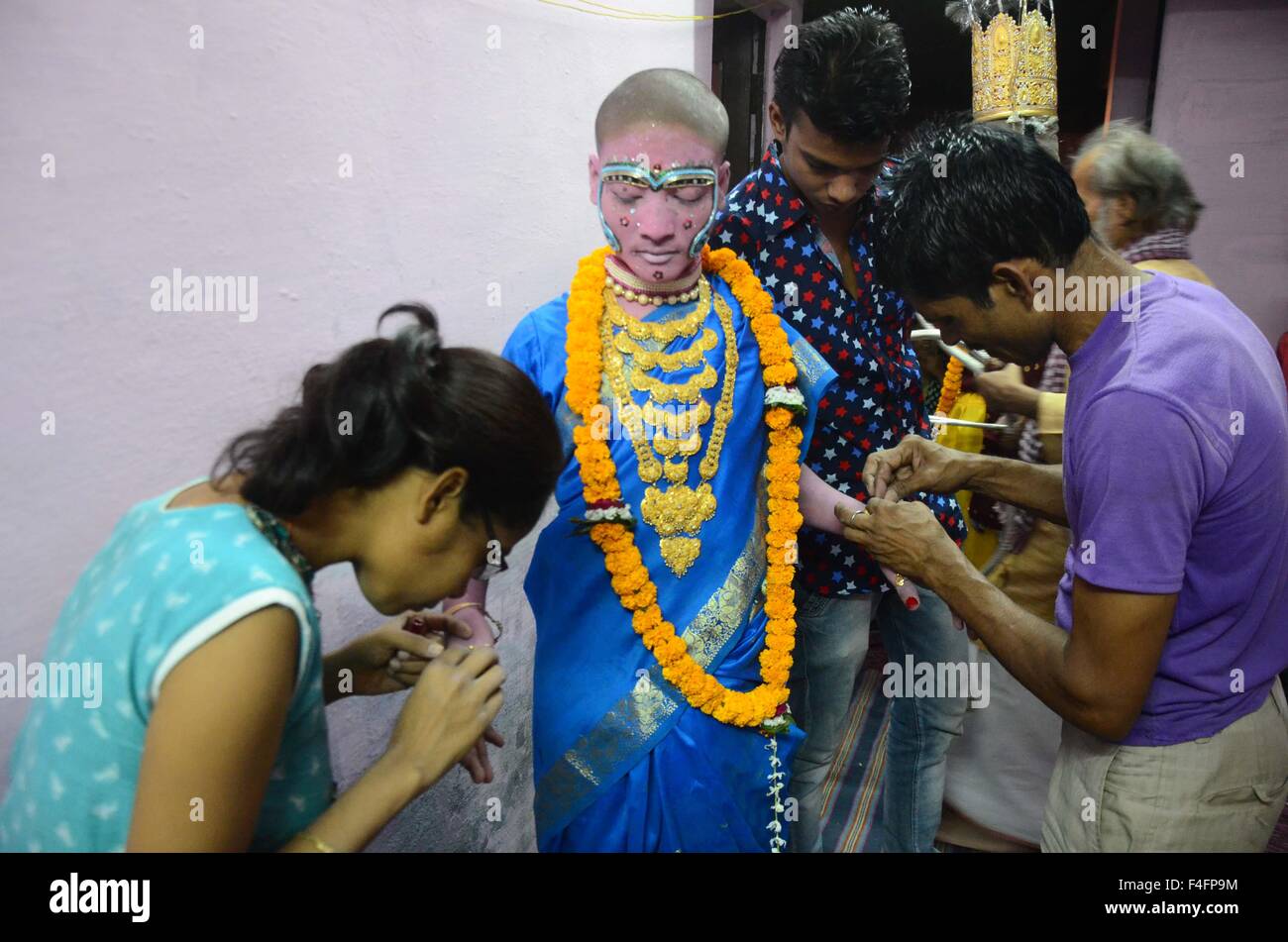 Allahabad, Prabhat kumar verma, India. 17th Oct, 2015. An makeup artist giving final touches to ...