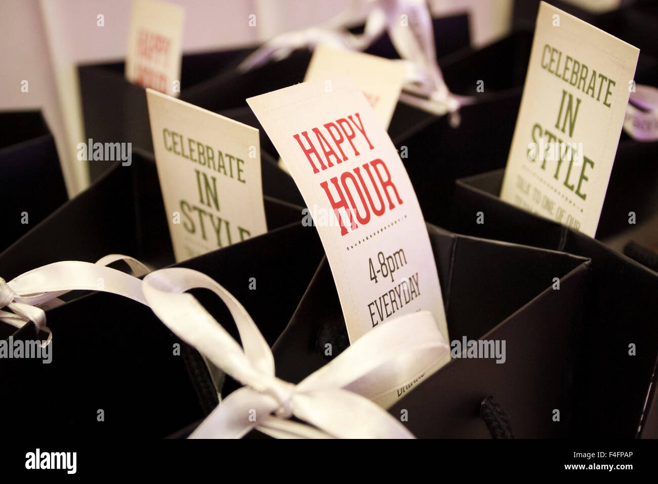 Goody bag of a Bar with Happy Hour and Celebrate in Style signs ...