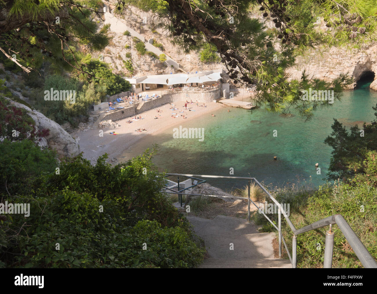 A small cove with pebble beach and steep cliffs, Dalmatian coast at its ...