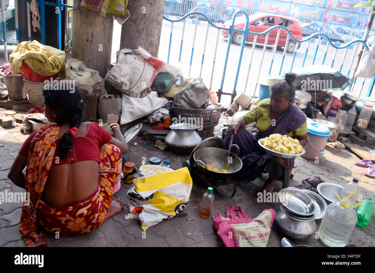 Women living in the streets cooking their food. The International Day ...