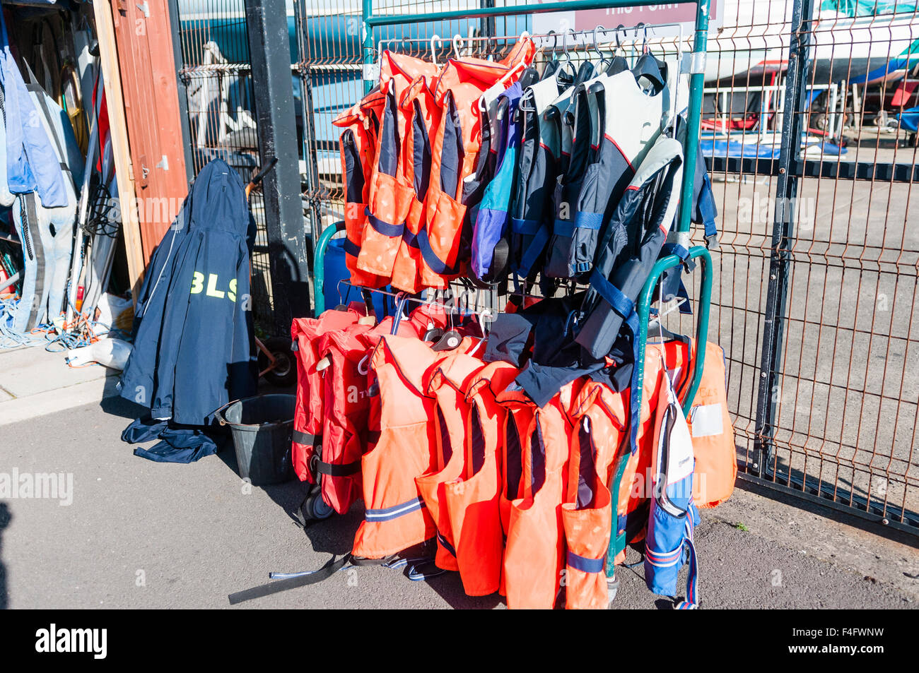 Life jackets on a rack at a sailing club Stock Photo - Alamy