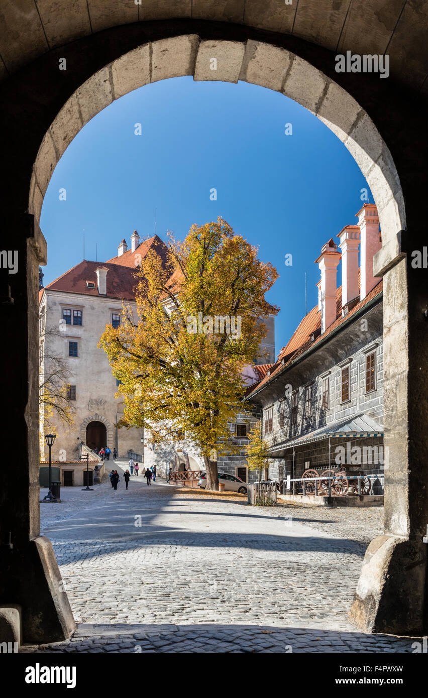Autumn view of forecourt of Cesky Krumlov Castle framed in entrance ...