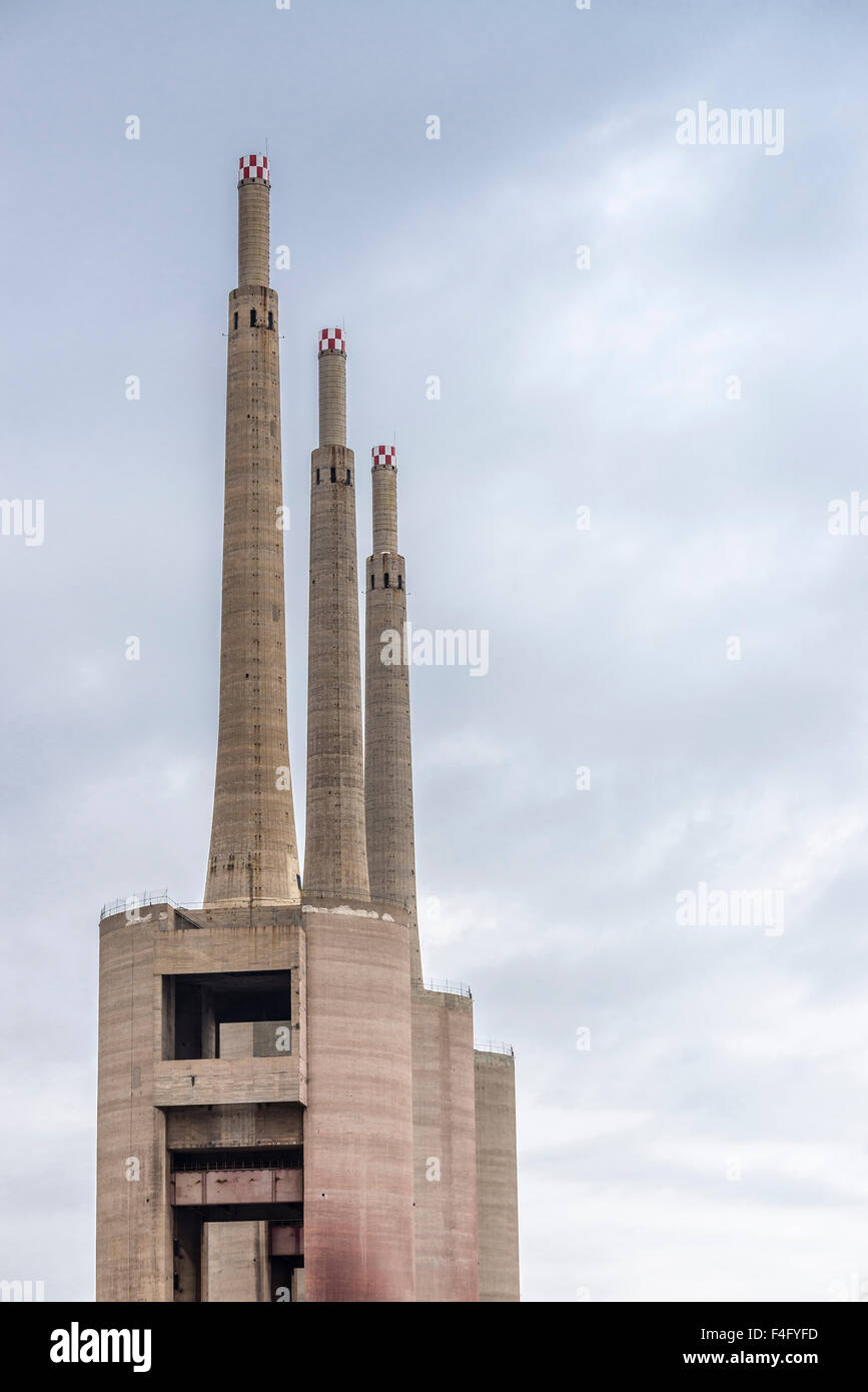 Three chimneys of a thermal power plant closed in Barcelona, Catalonia ...