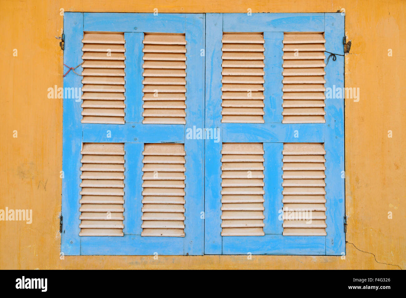 Blue window shutters Stock Photo - Alamy