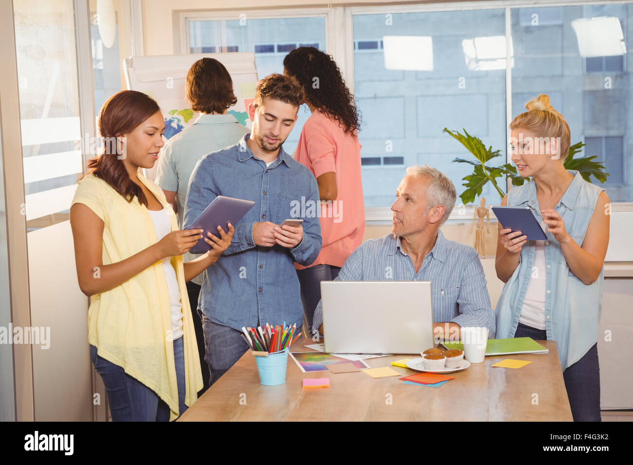 Business people using technologies during meeting Stock Photo - Alamy