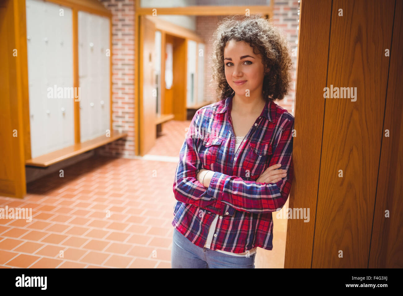 Smiling female student arms hi-res stock photography and images - Alamy
