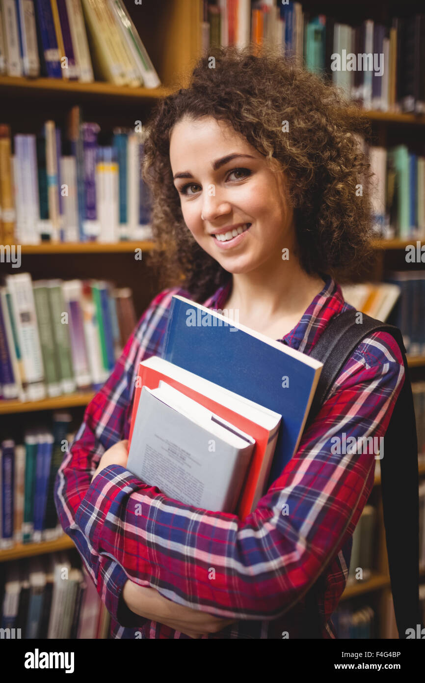 Pretty student in the library Stock Photo - Alamy