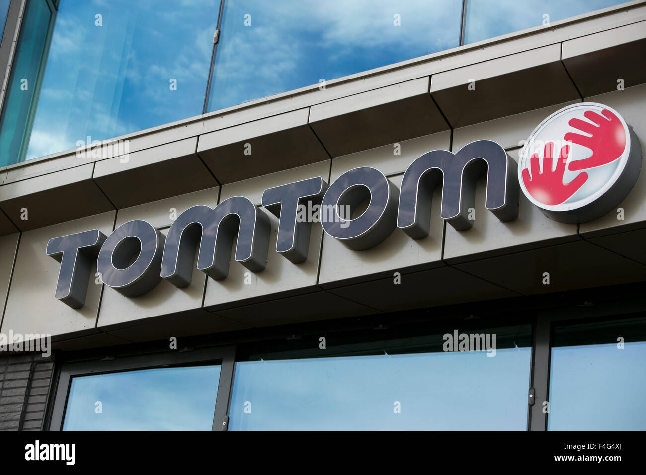 A logo sign outside of the headquarters of TomTom NV in Amsterdam ...