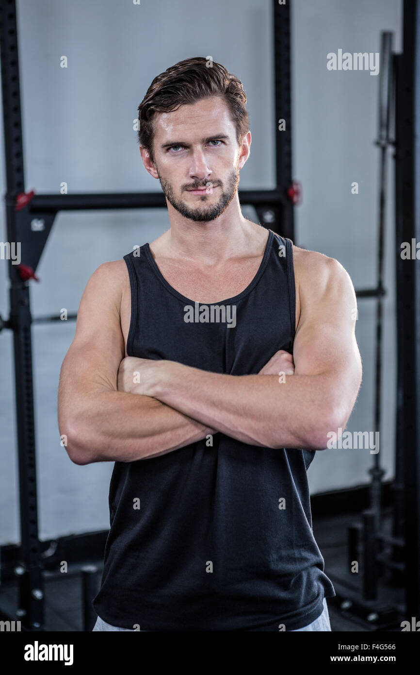 Fit man with arms crossed Stock Photo - Alamy