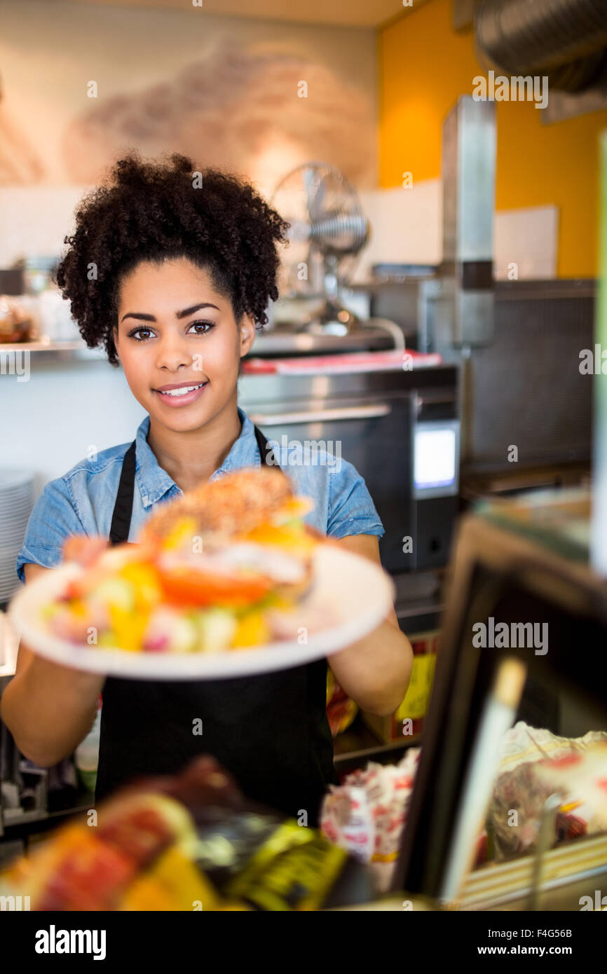 Pretty young female waitress serving hi-res stock photography and ...