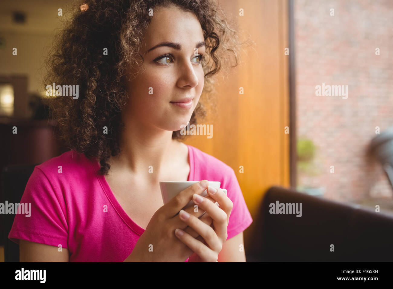 Pretty student having a coffee Stock Photo - Alamy