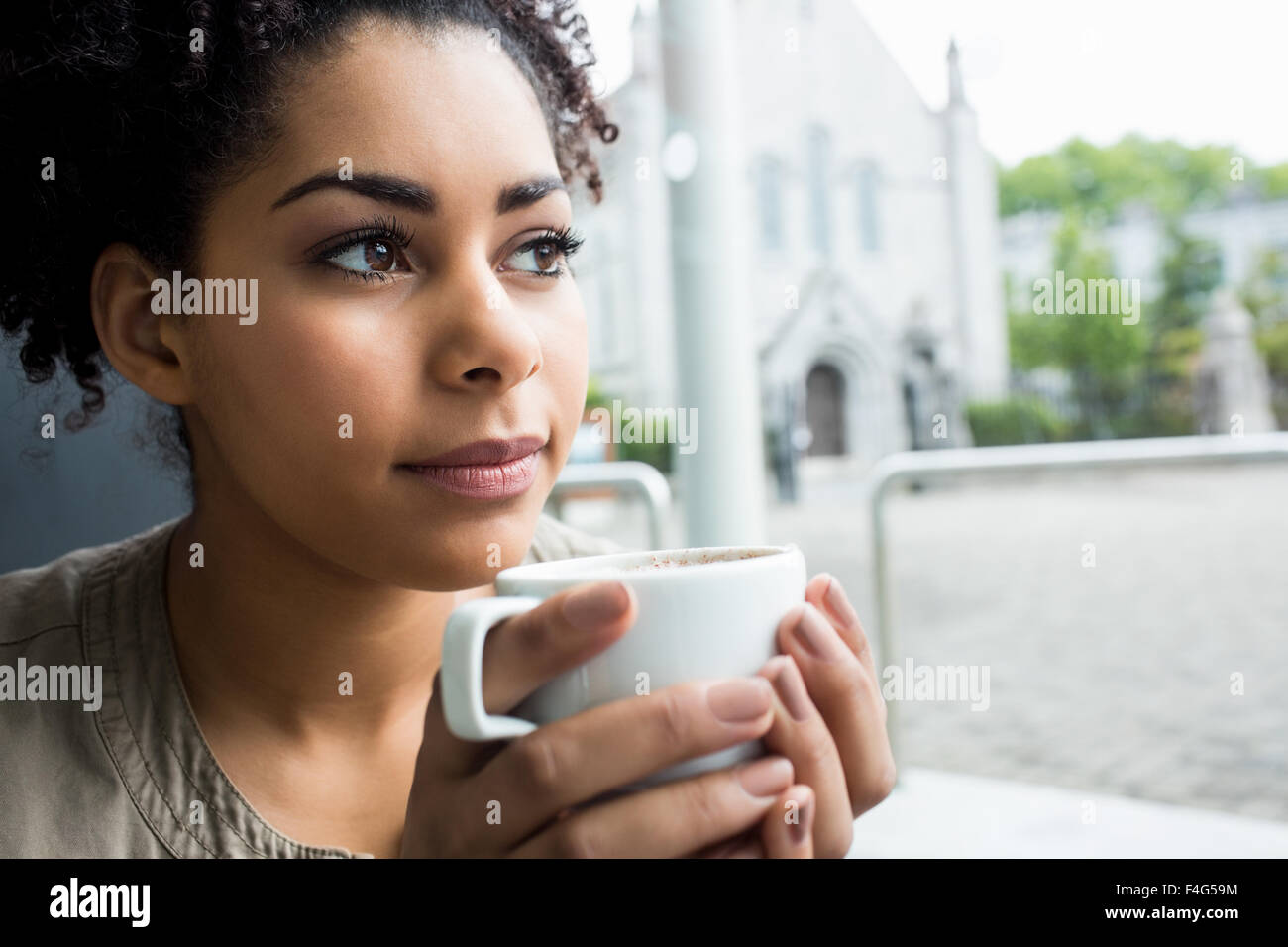 Pretty student having a coffee Stock Photo - Alamy