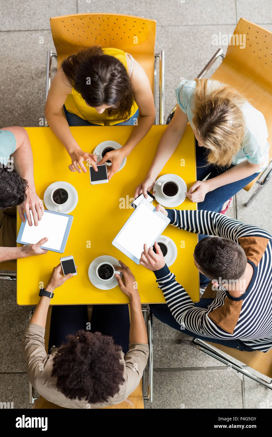 People Using Smartphones And Tablets