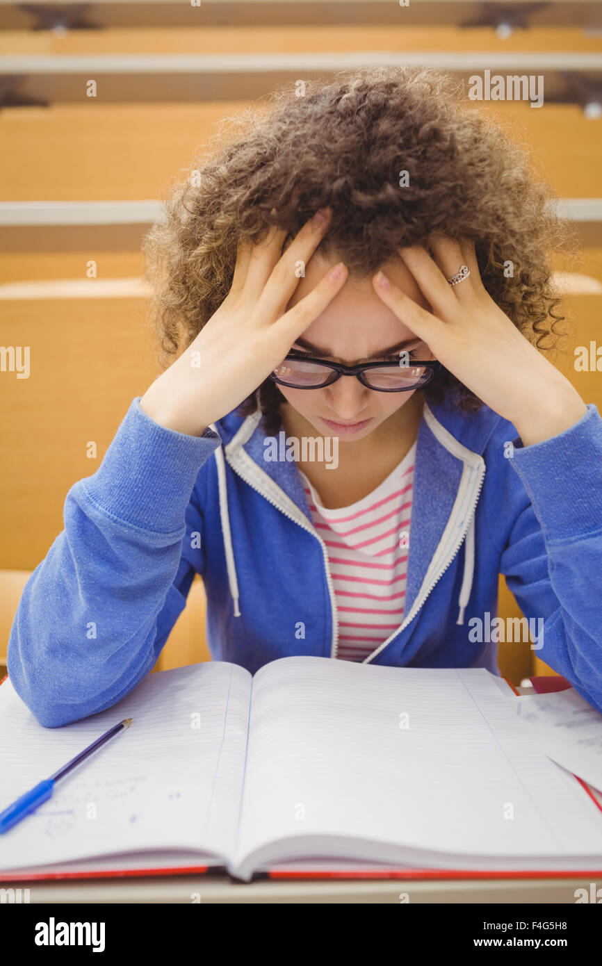 Stressed student in lecture hall Stock Photo - Alamy