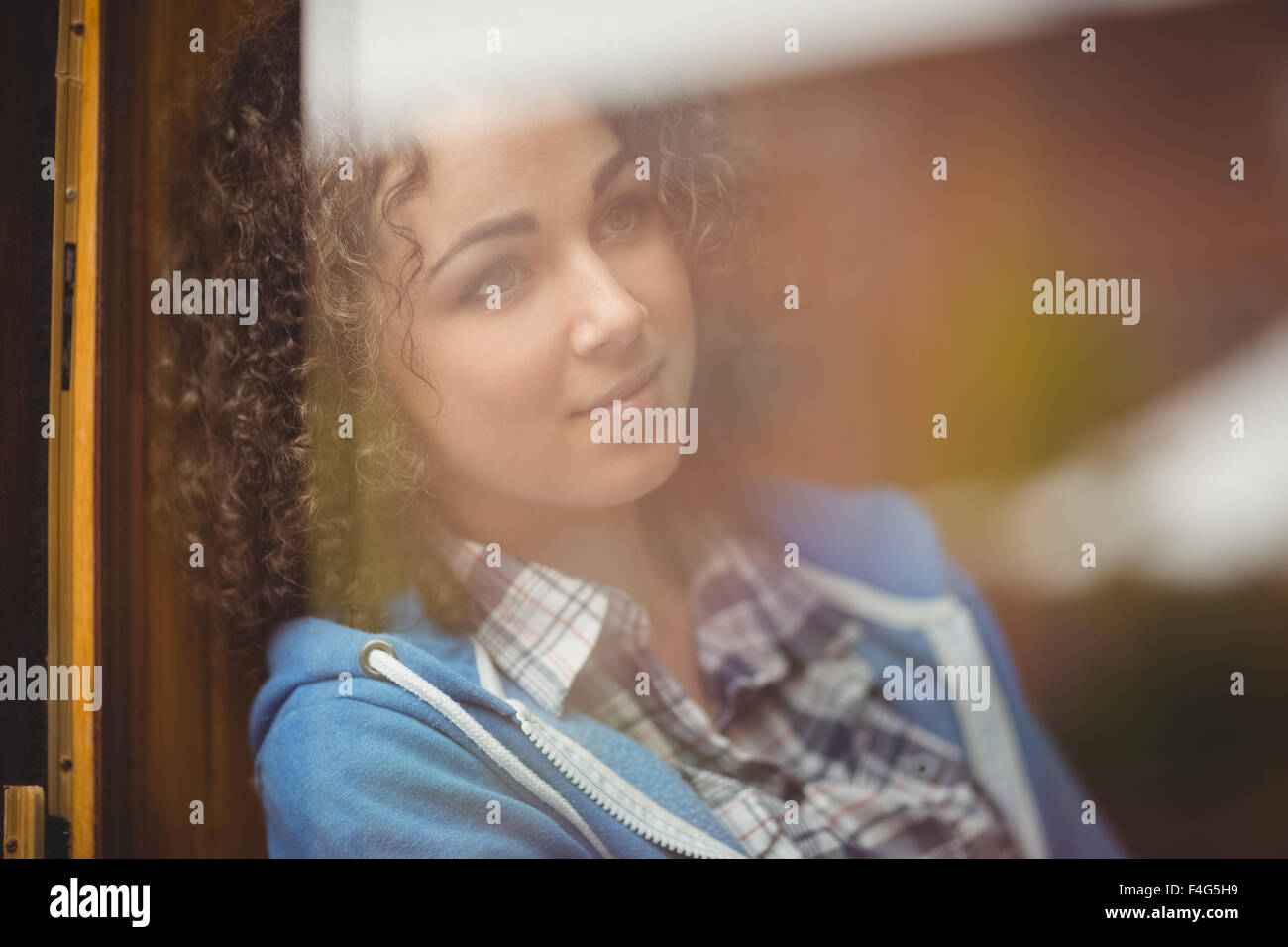 Pretty student sitting by the window Stock Photo - Alamy