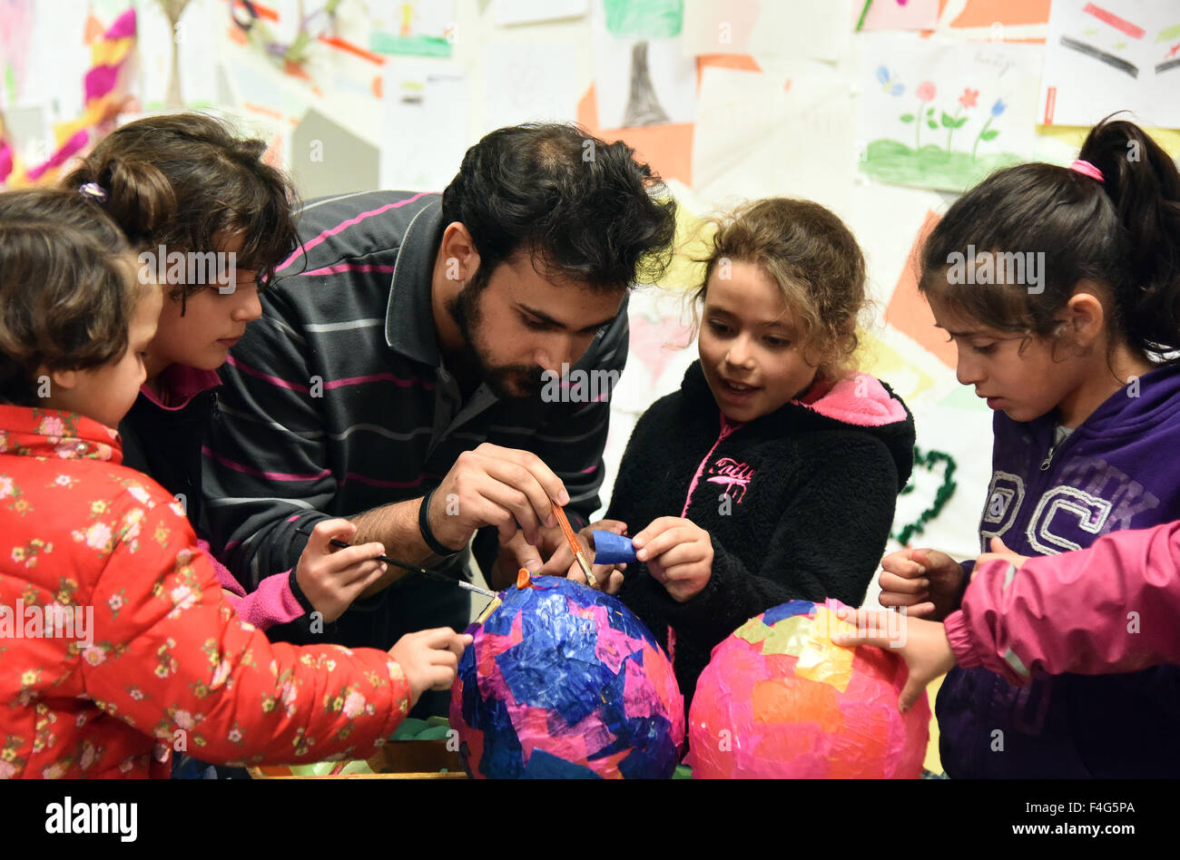 Ellwangen, Germany. 14th Oct, 2015. Samy Samour doing arts and crafts ...