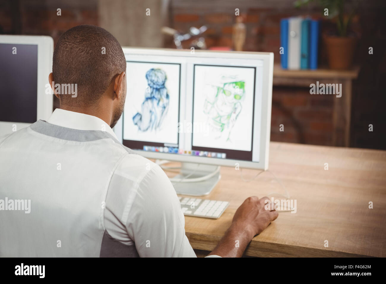 Cartoonist working on computer Stock Photo - Alamy