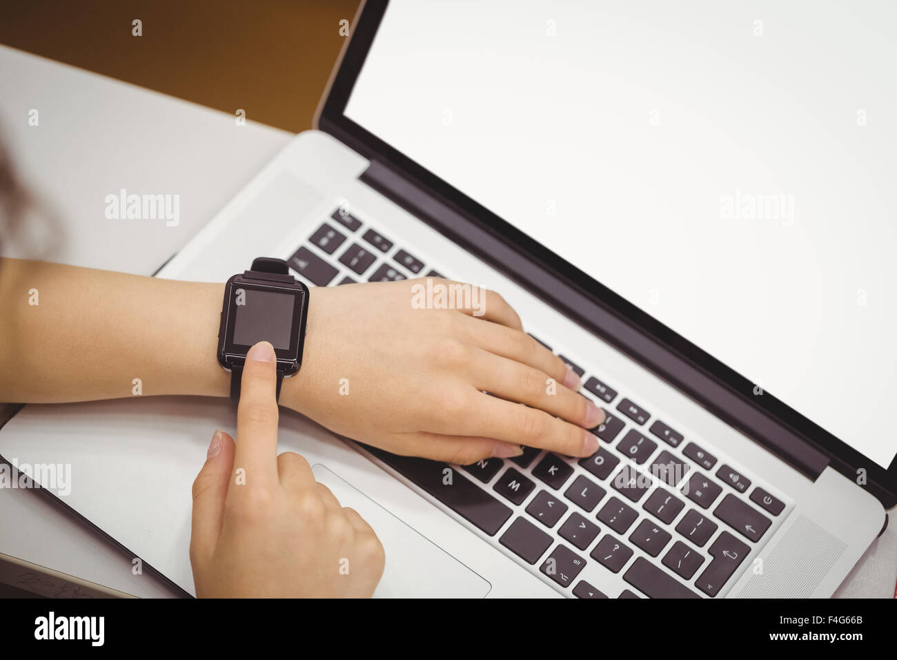 Pretty student in lecture hall with smartwatch Stock Photo - Alamy