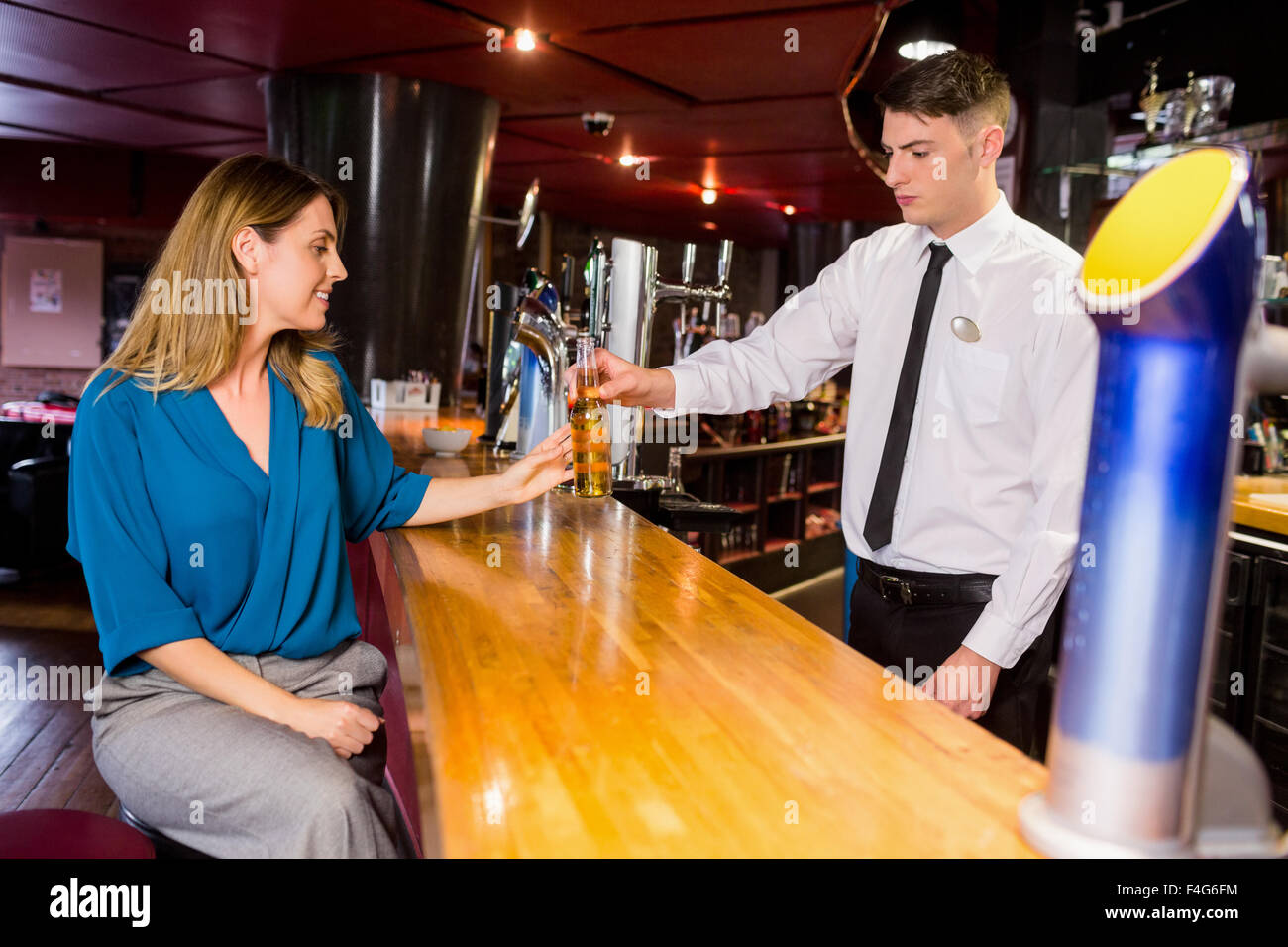 Man offering bottle hi-res stock photography and images - Alamy