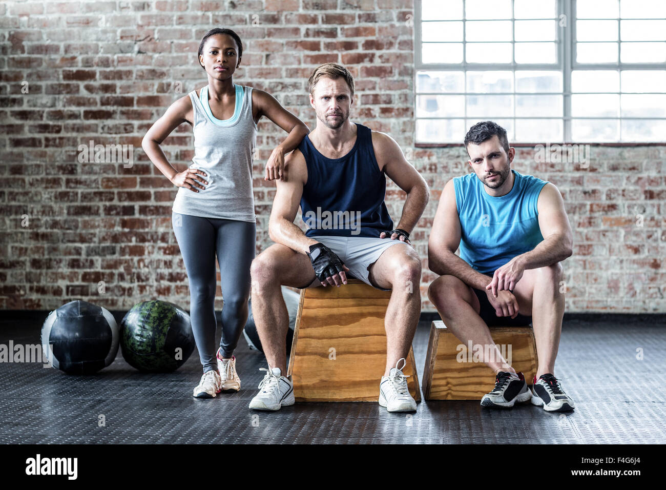Fit serious people posing together Stock Photo - Alamy