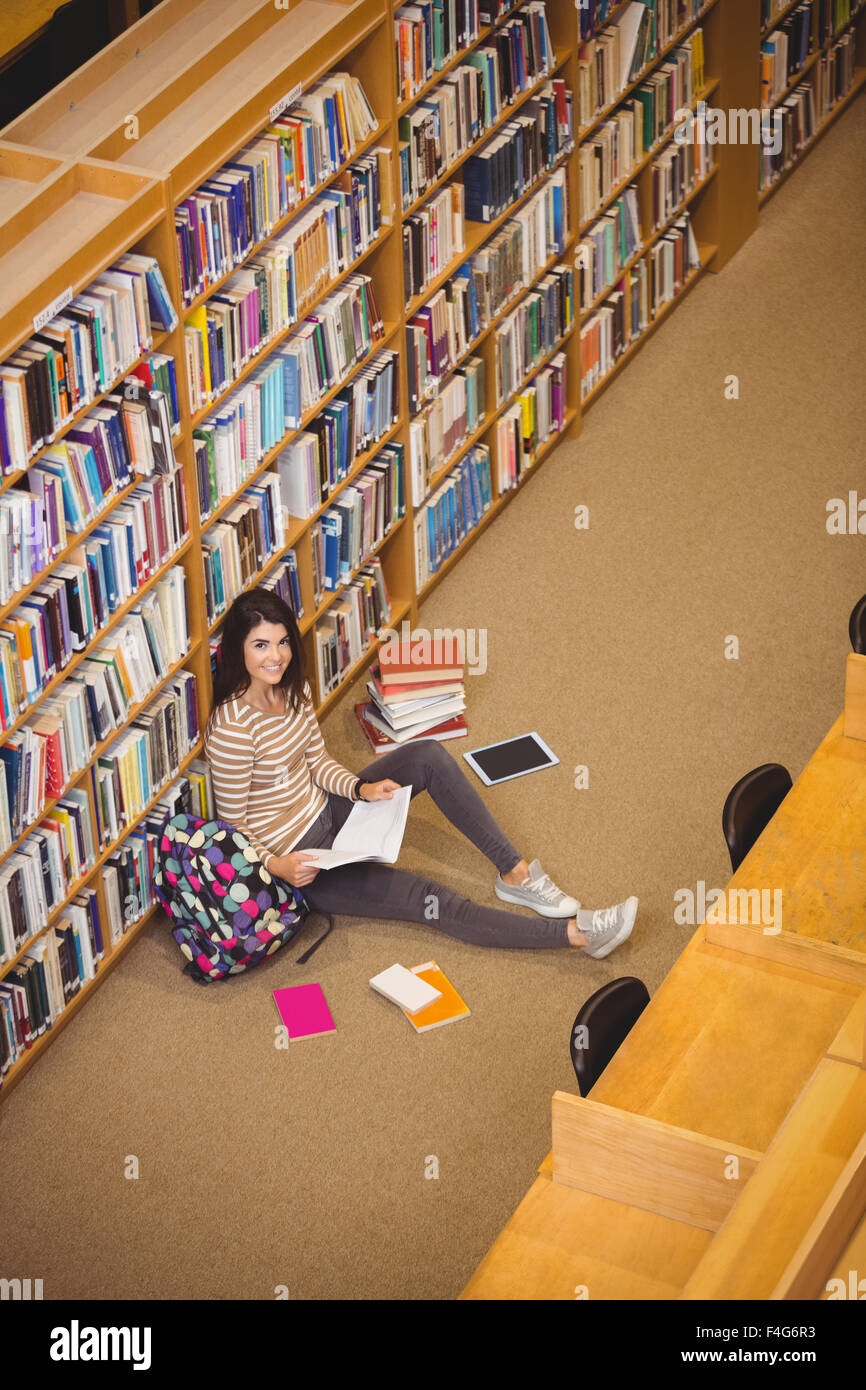 Portrait of cheerful young student with book Stock Photo - Alamy