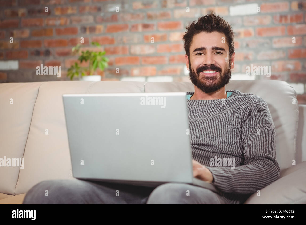 Relaxed man using smart hi-res stock photography and images - Alamy