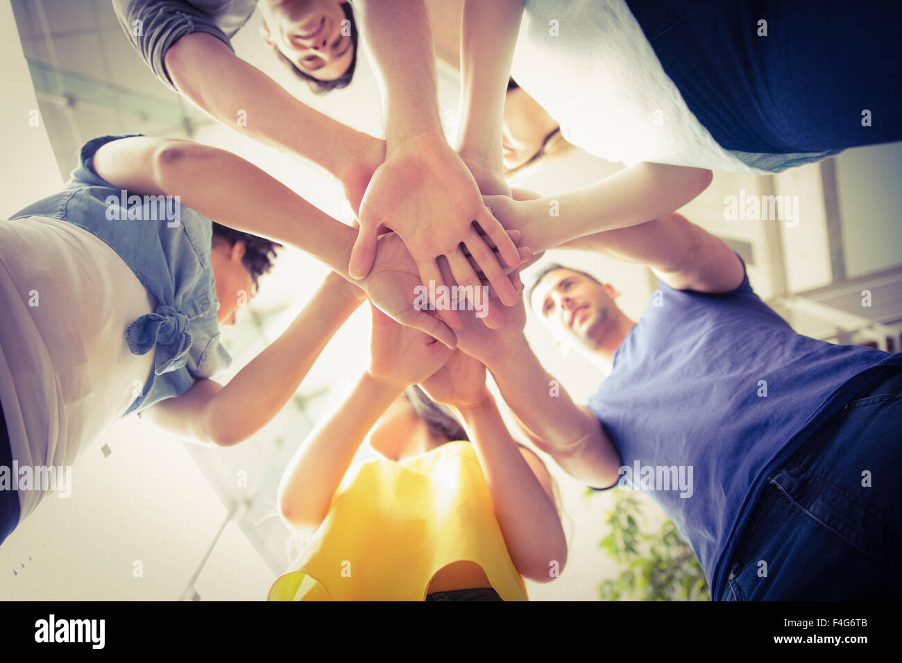 Students putting heads together in unity Stock Photo - Alamy