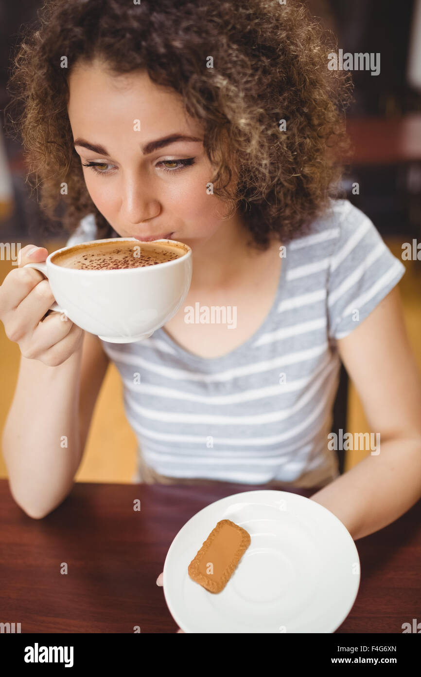 Pretty student having a coffee Stock Photo - Alamy