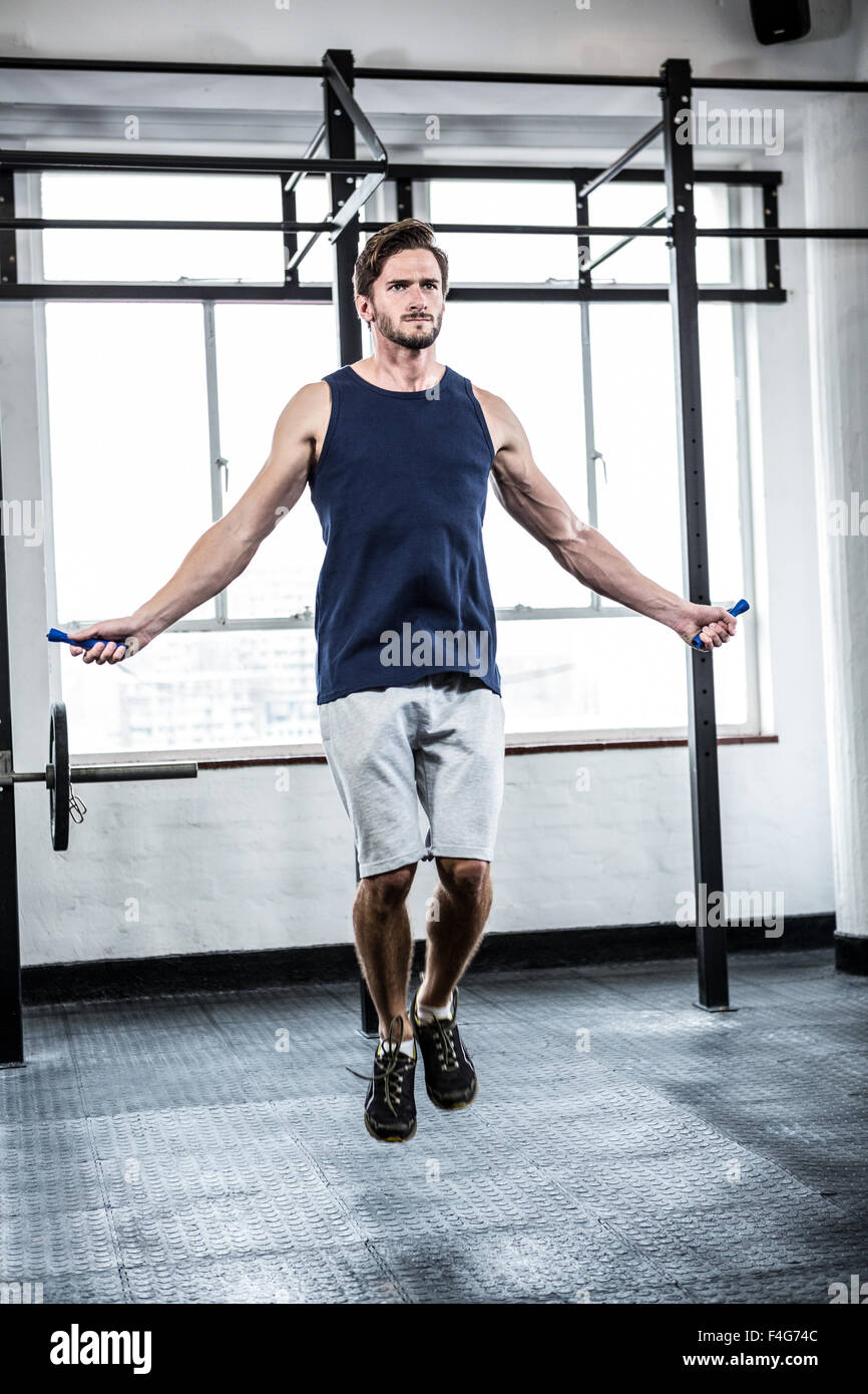 Fit man with skipping rope Stock Photo - Alamy