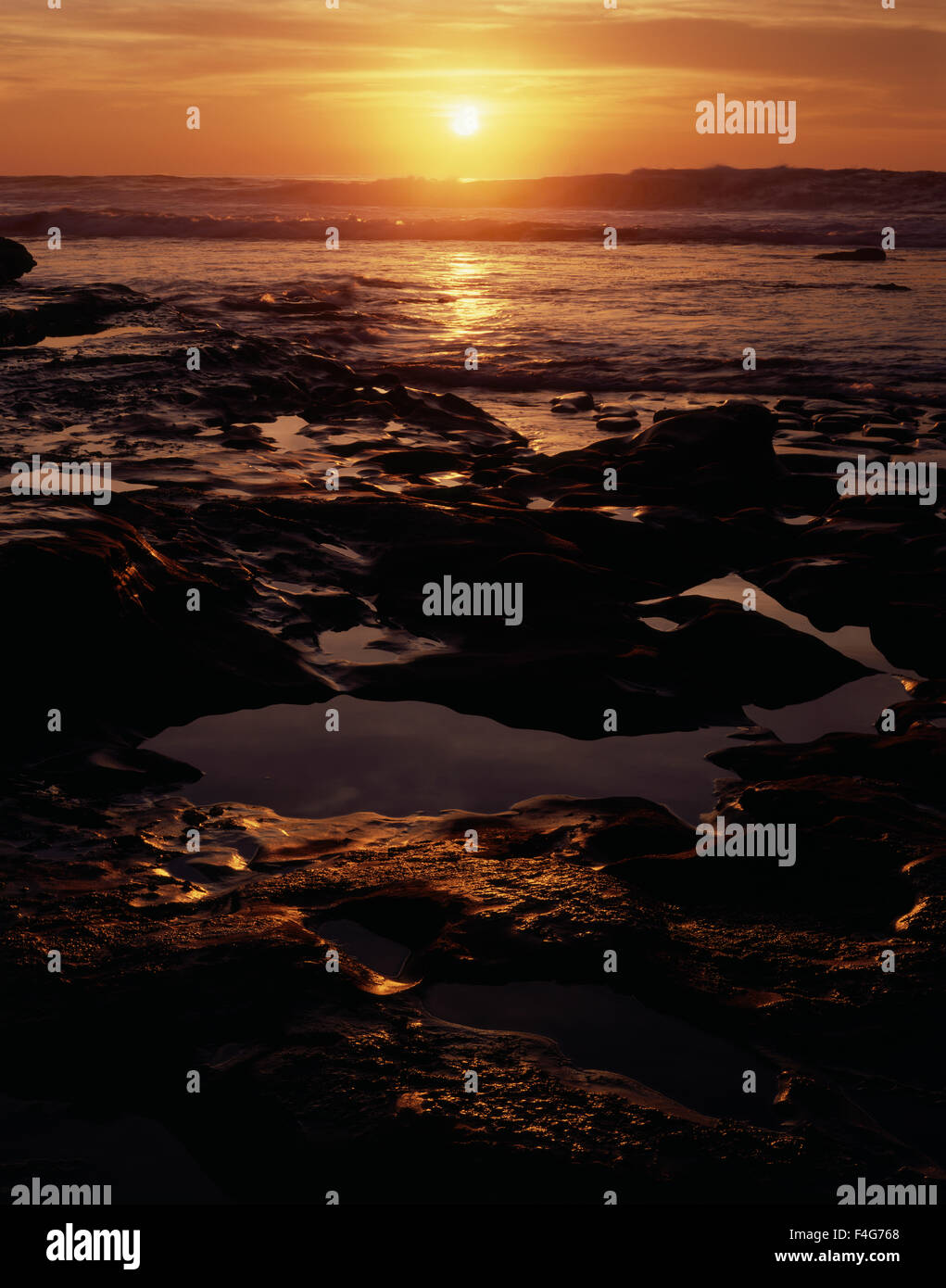 California, San Diego, La Jolla, Sunset over tide pools on the Pacific ...
