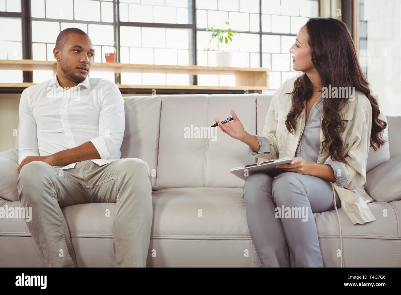 Therapist talking with patient Stock Photo - Alamy