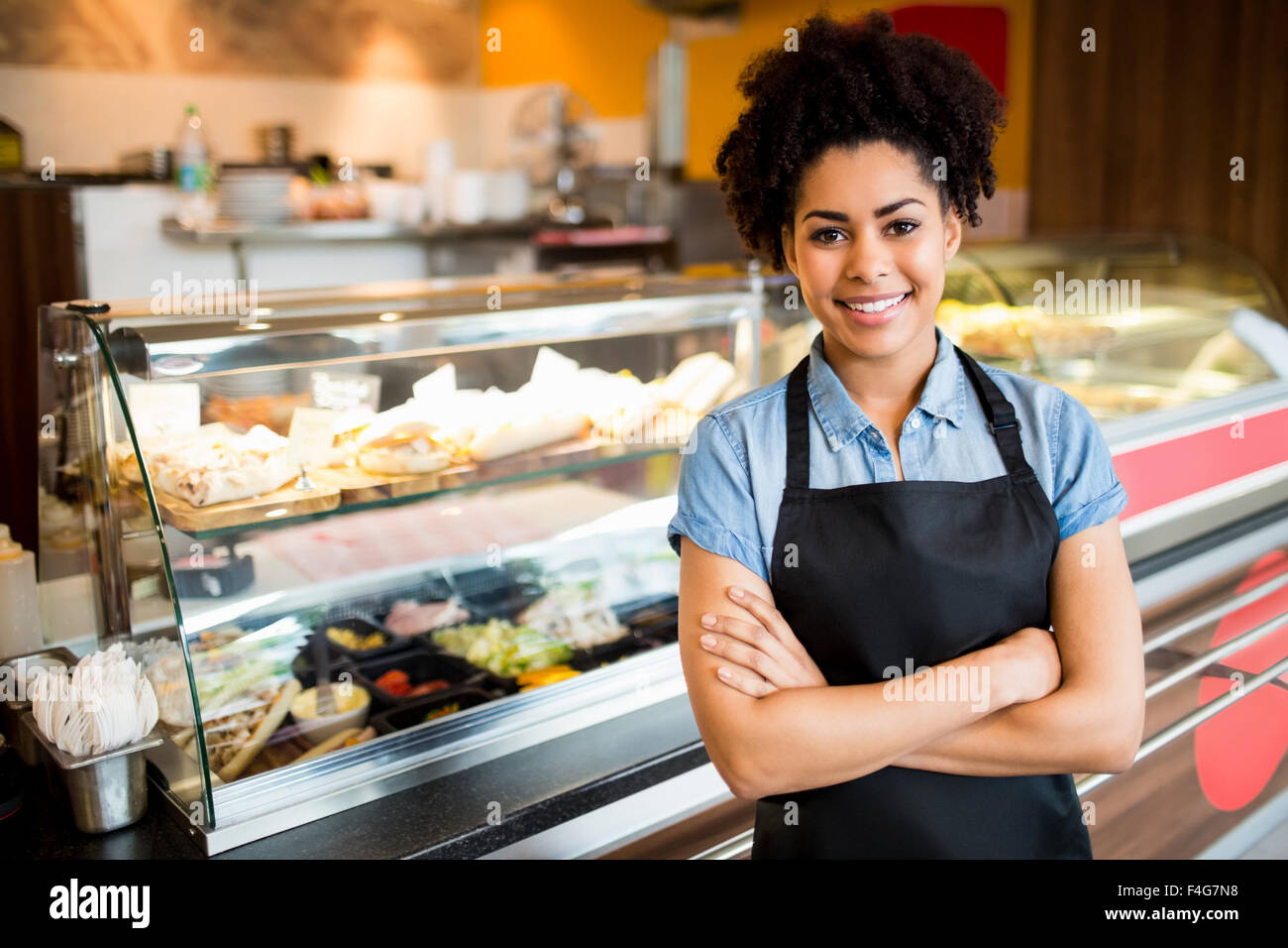 Pretty waitress smiling at camera Stock Photo - Alamy