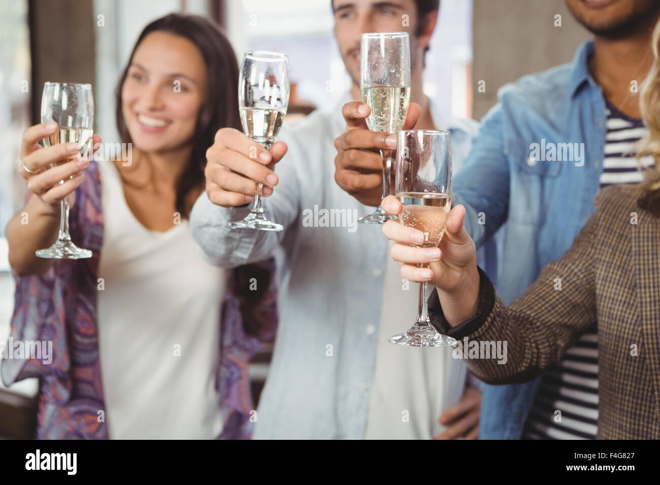 Business people raising champagne glass Stock Photo - Alamy