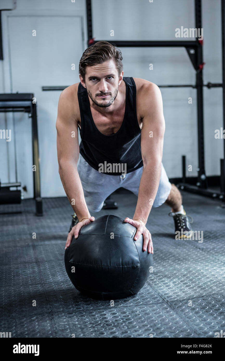Fit man working out with ball Stock Photo - Alamy
