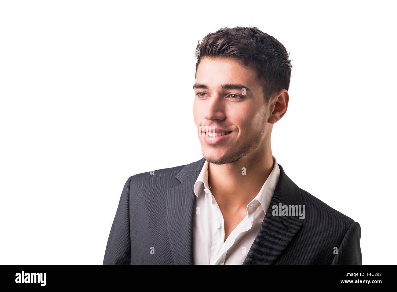 Young businessman confidently posing in front of camera, wearing suit ...