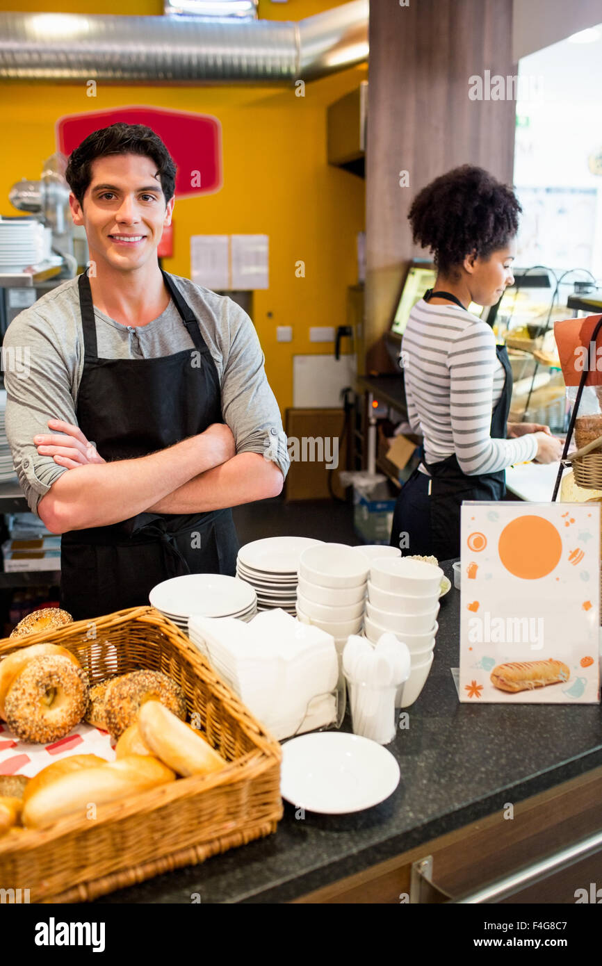 Handsome waiter smiling at camera Stock Photo - Alamy
