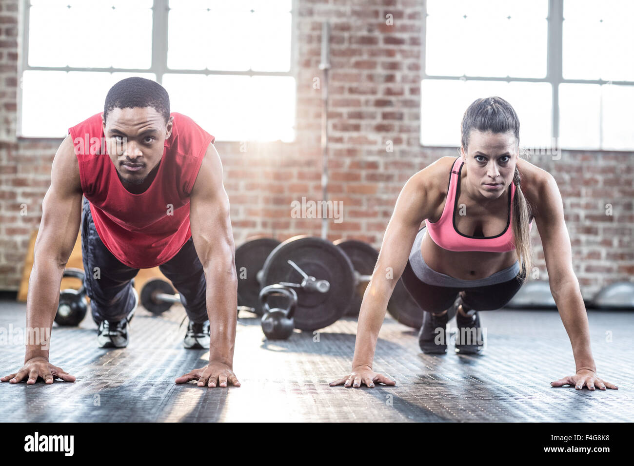 Fit couple doing push ups Stock Photo - Alamy