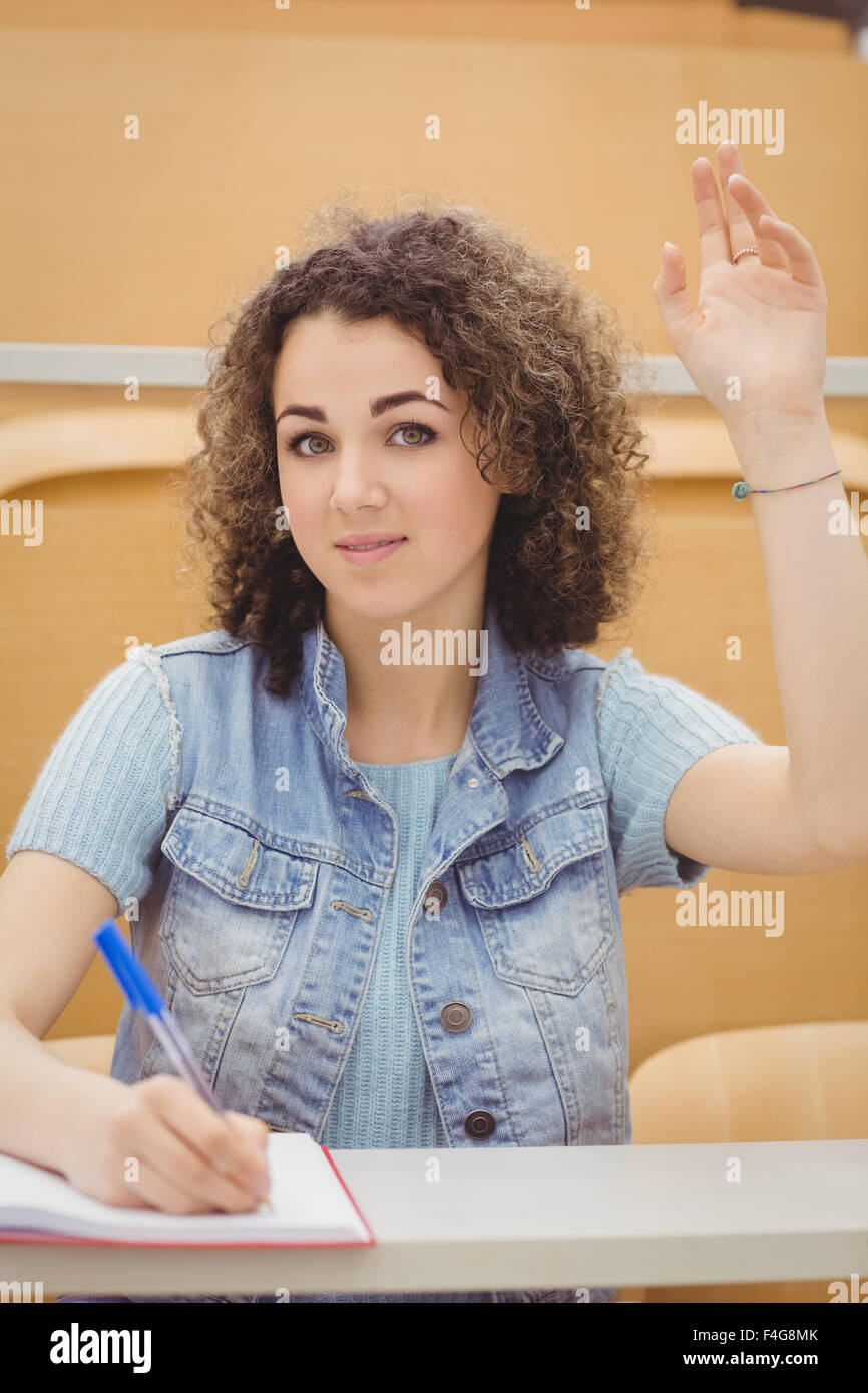 Student raising hand in lecture Stock Photo - Alamy