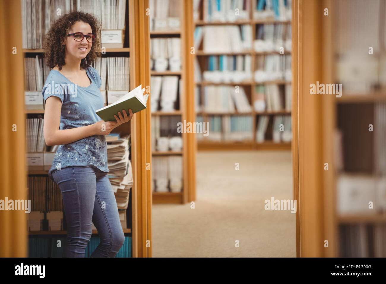 Student reading in library hi-res stock photography and images - Alamy
