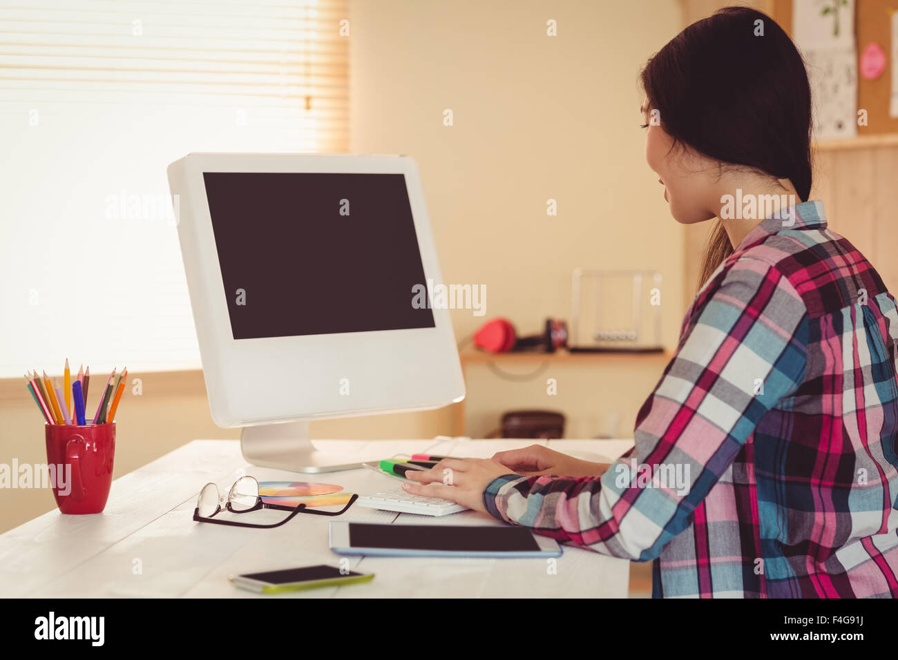 Young creating woman typing on keyboard Stock Photo - Alamy
