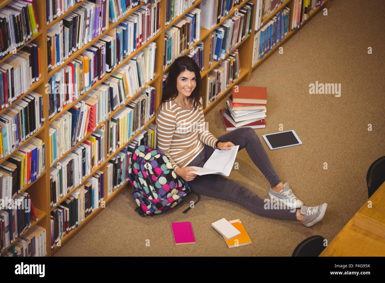 Portrait of happy young student with book Stock Photo - Alamy
