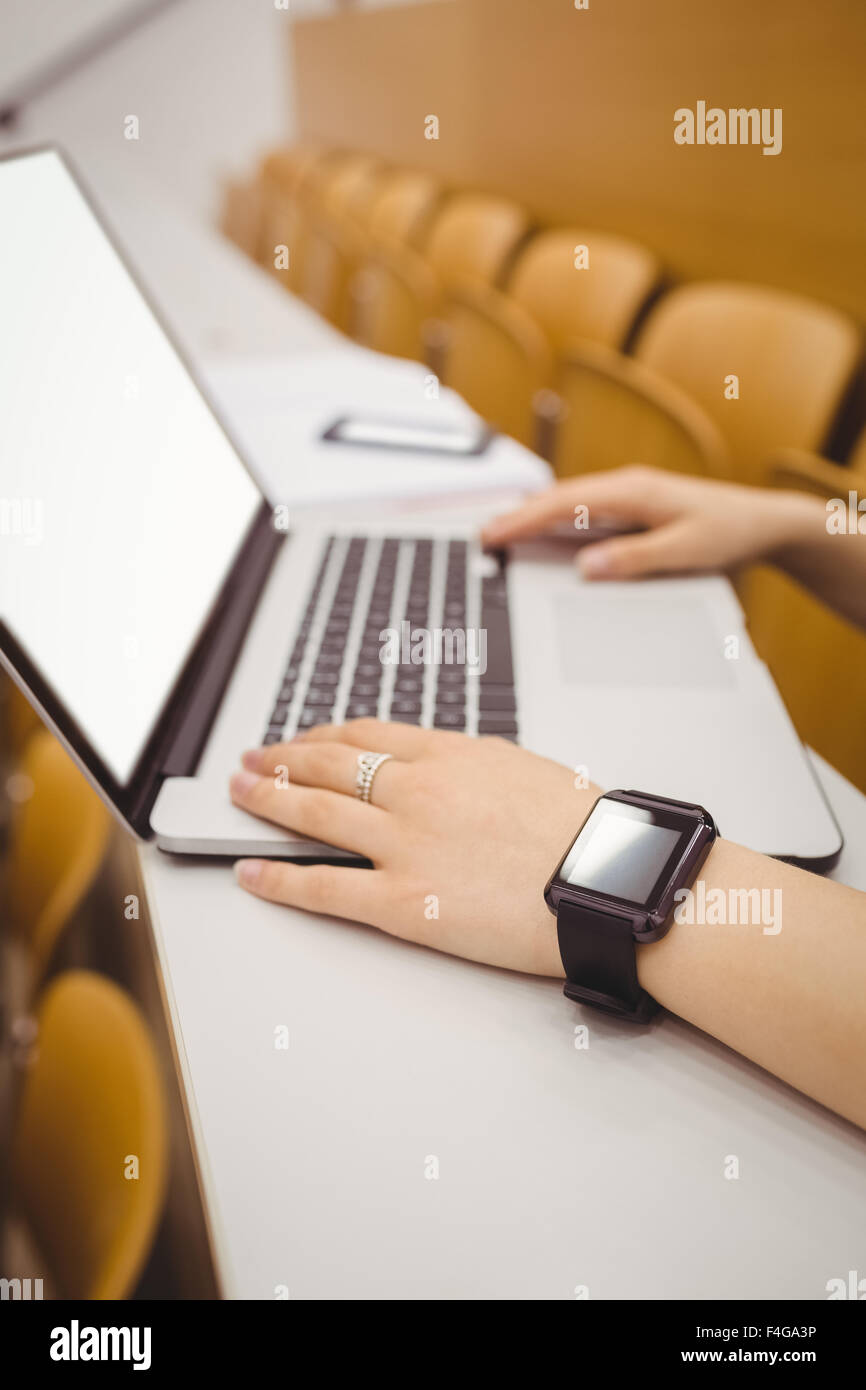 Pretty student in lecture hall with smartwatch Stock Photo - Alamy