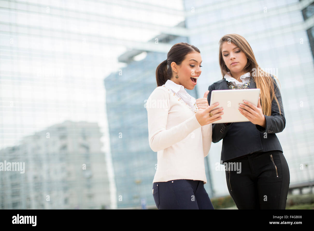 Young business women in front of office building Stock Photo - Alamy
