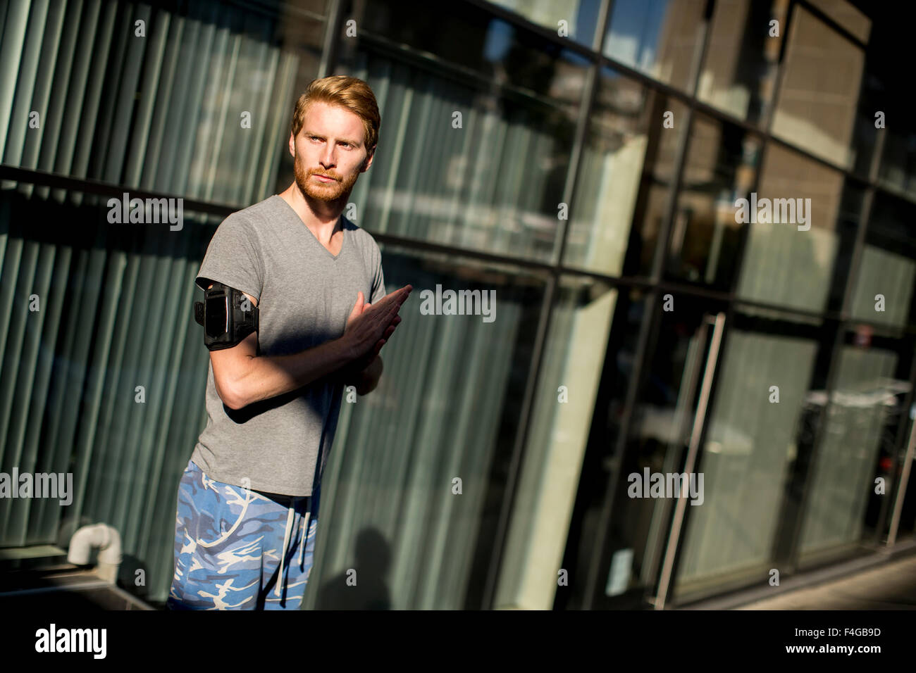 Young man running in the urban area Stock Photo - Alamy