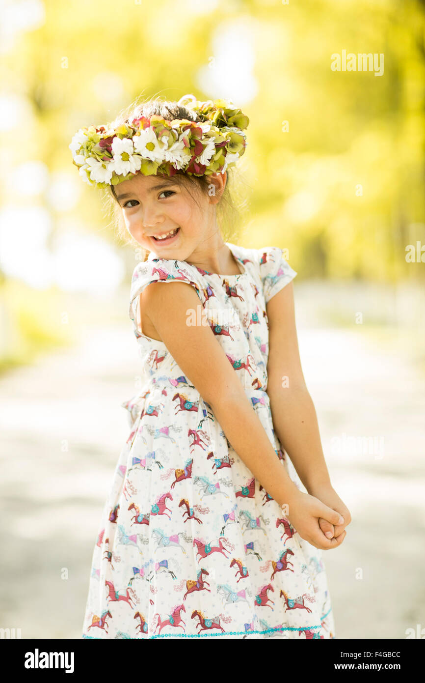 Little girl in the summer park Stock Photo - Alamy