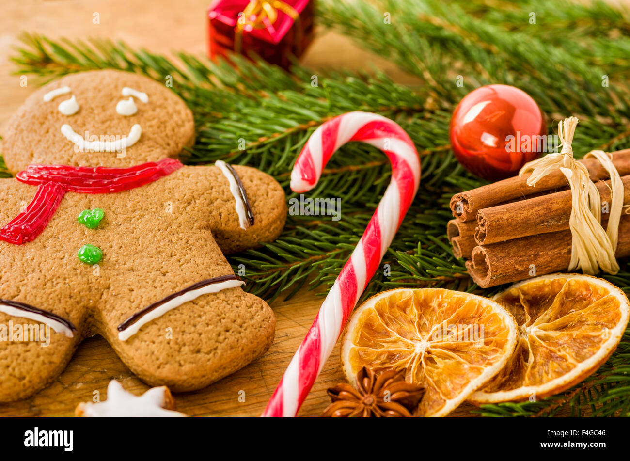A gingerbread man with a candy cane Stock Photo - Alamy