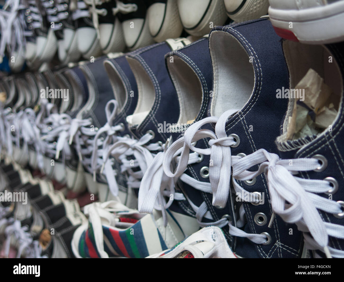 Footwear stall displaying shoes Stock Photo - Alamy