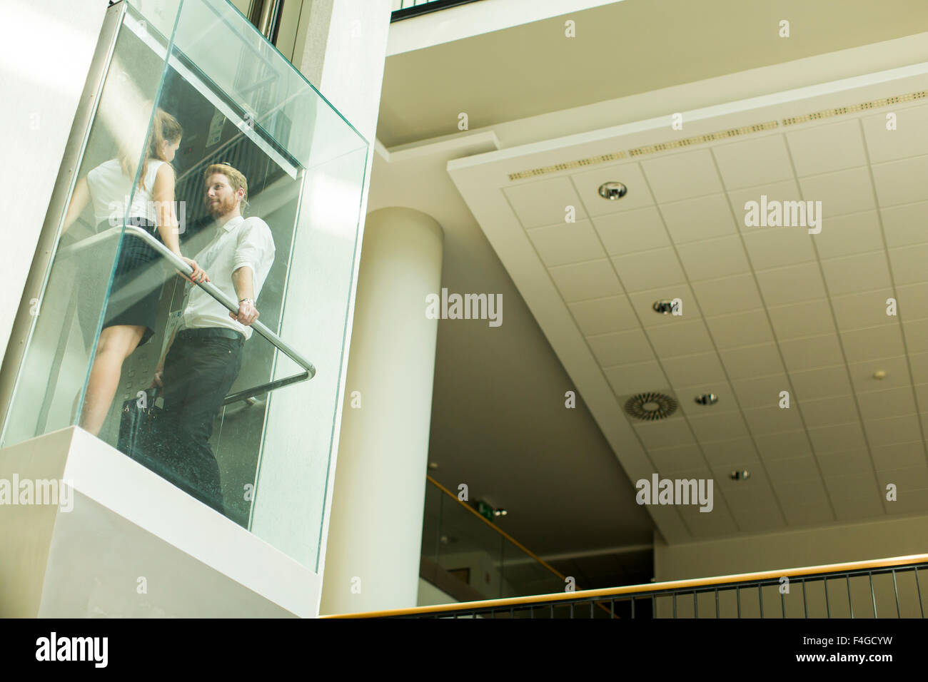 Man and woman in the elevator Stock Photo - Alamy