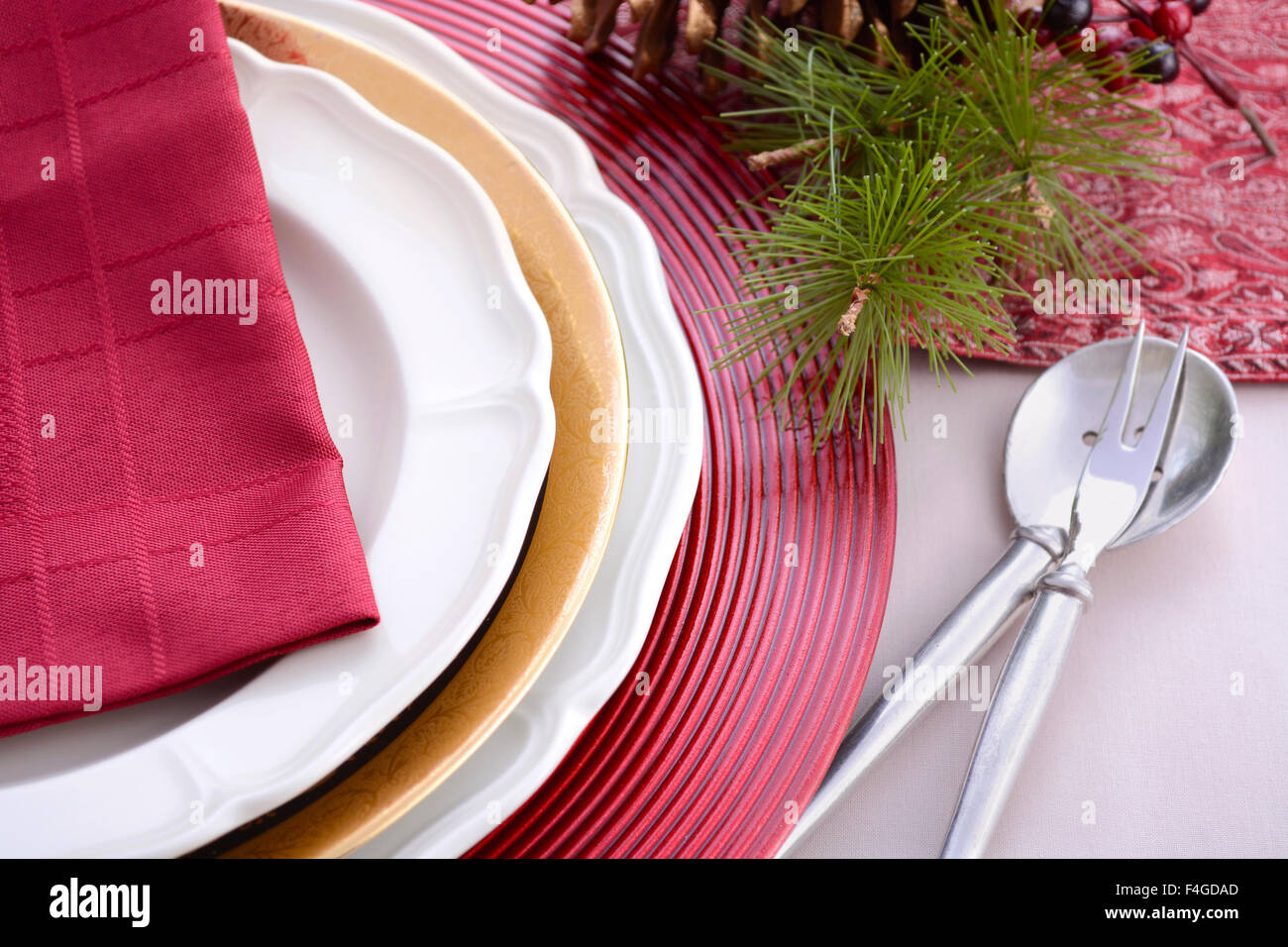 Traditional red theme festive table place setting for Christmas or ...